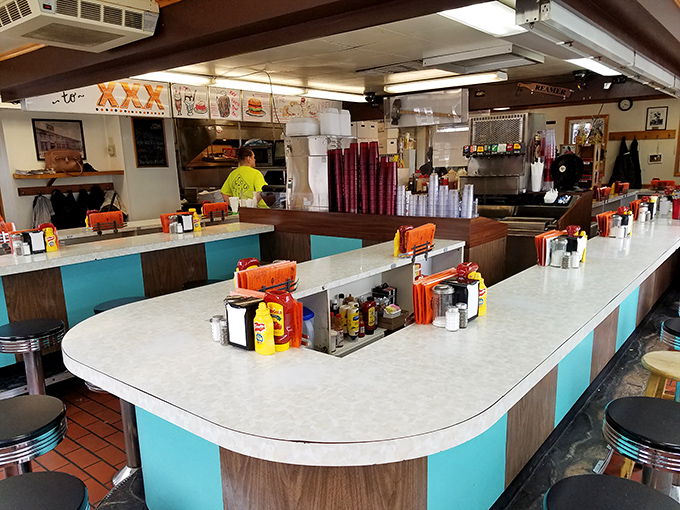 The horseshoe counter isn't just seating&mdash;it's theater-in-the-round where diners become part of a decades-old culinary performance art.