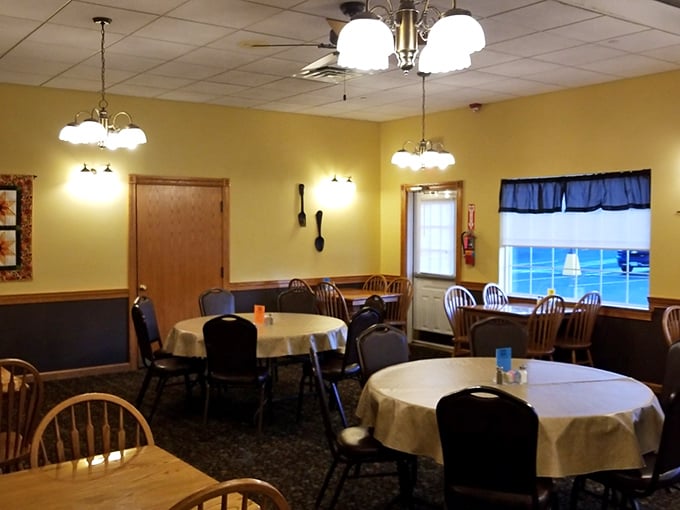 Warm yellow walls, simple chandeliers, and tablecloths that remind you of Sunday dinners at grandma's&mdash;this is where memories are made between bites. 