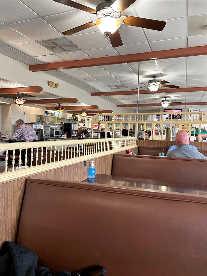 Classic wooden booths and spindle dividers create that perfect diner atmosphere &ndash; where comfort trumps trendiness and conversations flow as freely as the coffee.