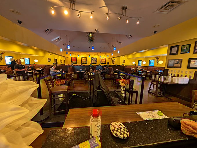 Step inside to a world where yellow walls create an atmosphere as sunny as a perfect Florida morning, with colorful artwork adding personality.