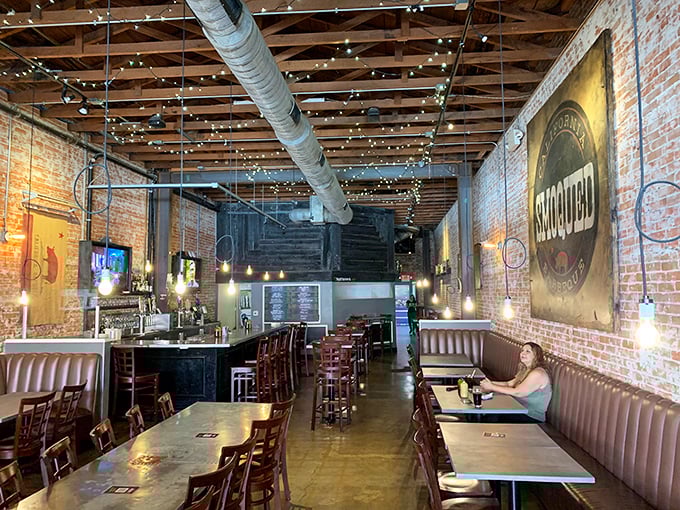 Step inside and the magic reveals itself: exposed brick, twinkling lights, and the promise of smoky delights. This isn't just a restaurant&mdash;it's barbecue theater in the round.