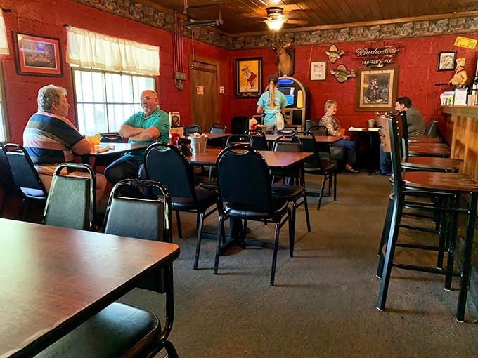 Red walls and rustic charm create the perfect backdrop for serious steak consumption. No white tablecloths needed when the food's this good.