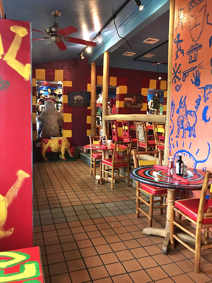 Step inside and prepare for sensory whiplash &ndash; vibrant folk art walls, wooden log columns, and colorful furniture create a dining space that's equal parts mountain lodge and modern art gallery.