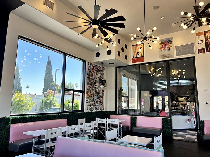 Mid-century meets millennial inside with those spectacular starburst light fixtures, pink booths, and enough natural light to make your Instagram shots pop without a filter.