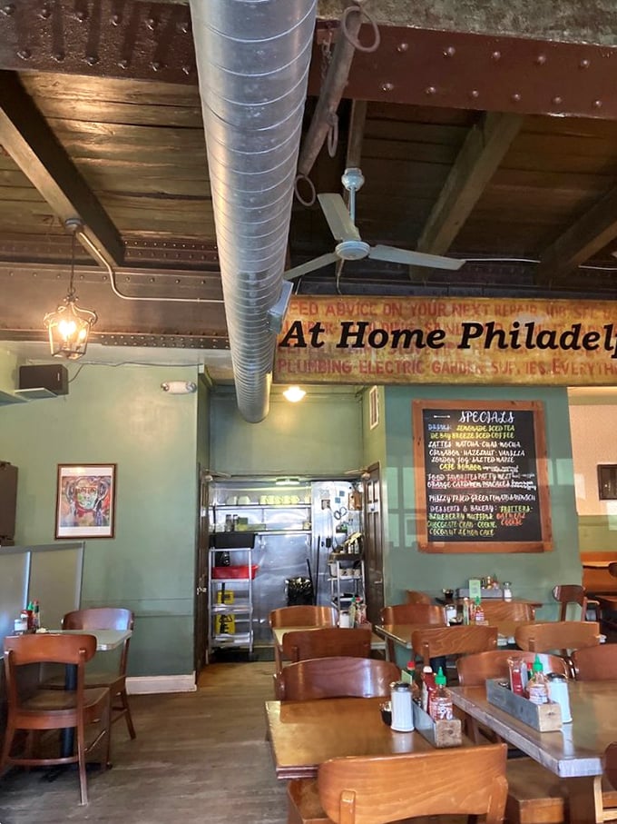 Industrial meets homey with mint green walls and exposed ductwork. The vintage "At Home Philadelphia" sign isn't lying&mdash;you'll want to move in permanently.