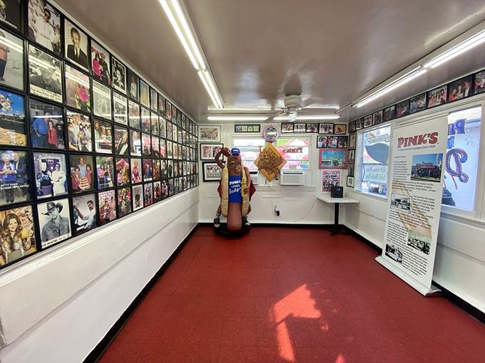 Step inside this celebrity photo gallery where every wall tells stories of famous folks united by chili dog love.