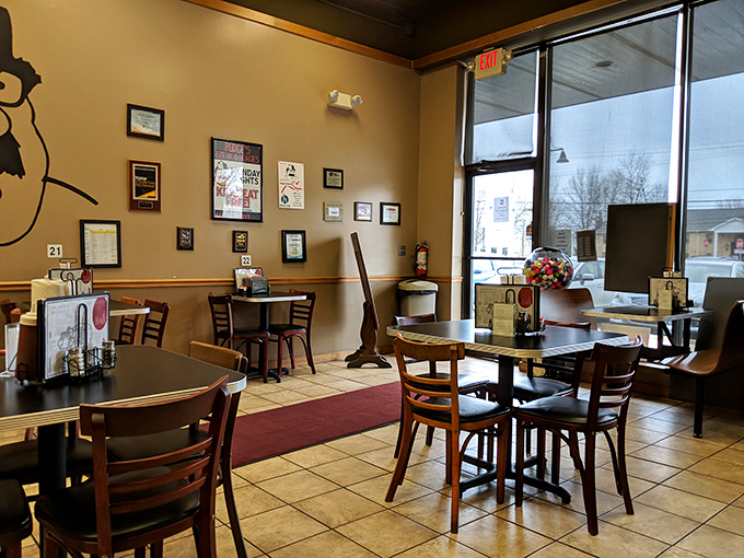 Simple tables, warm lighting, and that cartoon mascot watching over diners. This no-frills interior lets the food take center stage.