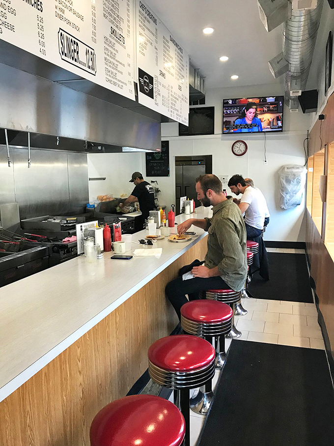 Counter culture at its finest&mdash;these red vinyl stools have witnessed more late-night confessions and early morning revelations than most therapists.