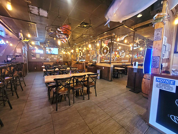 Nautical charm meets casual comfort in this dining room where fishing nets and wooden accents create the perfect backdrop for seafood feasting.