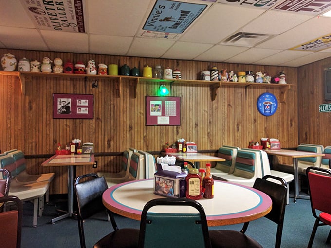 Wooden paneling, colorful chairs, and shelves lined with salt-and-pepper shakers – comfort begins before the food even arrives.