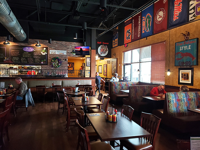 The interior strikes that perfect balance between casual and coastal charm, with colorful flags and memorabilia that whisper, "Vacation starts now."