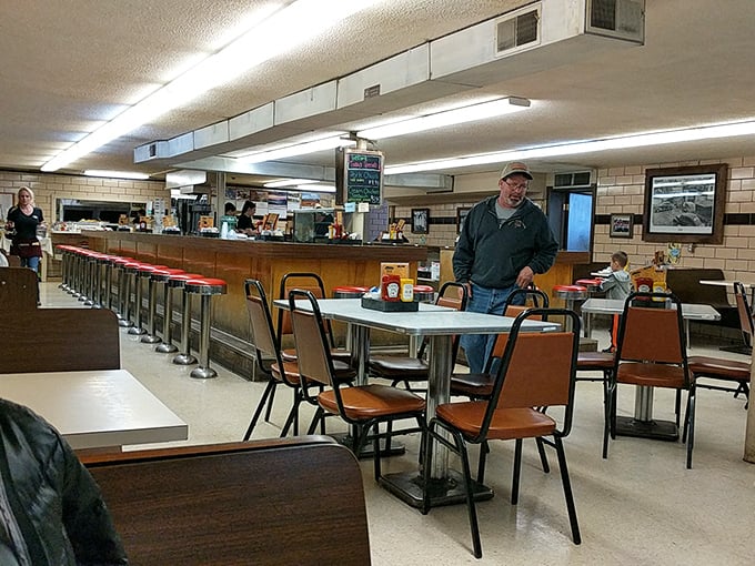 Old-school counter service where conversations flow as freely as the coffee. This no-nonsense dining area has witnessed decades of local gossip and satisfied sighs.