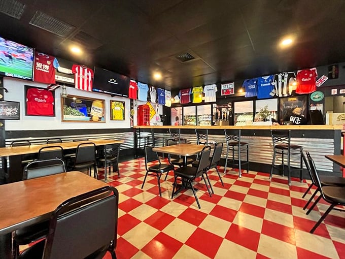 Red checkered floors and football jerseys create the perfect backdrop for proper fish and chips conversations.