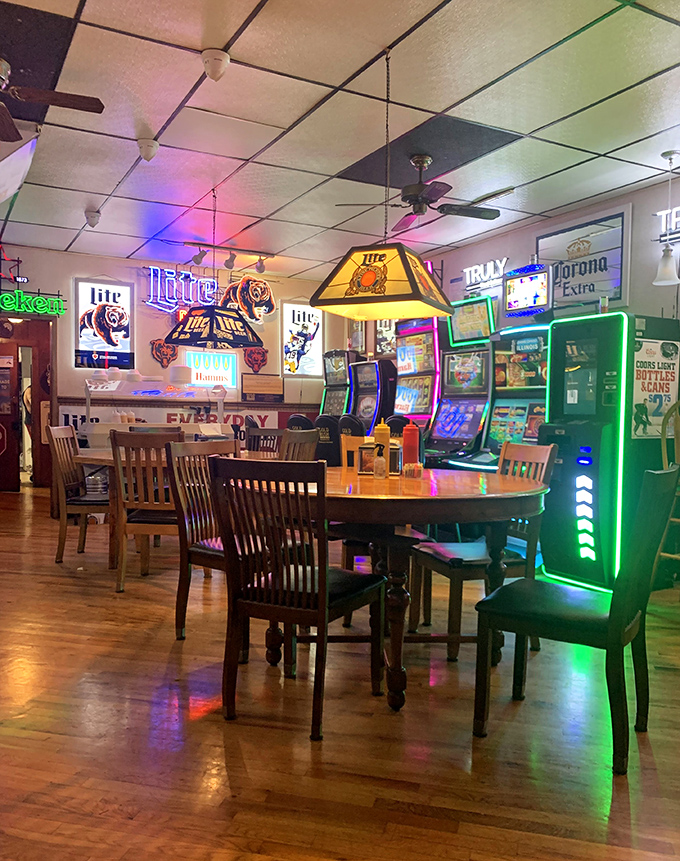 Beer signs cast their colorful glow across wooden tables while video gaming machines stand sentinel. This isn't hipster nostalgia—it's the real deal.