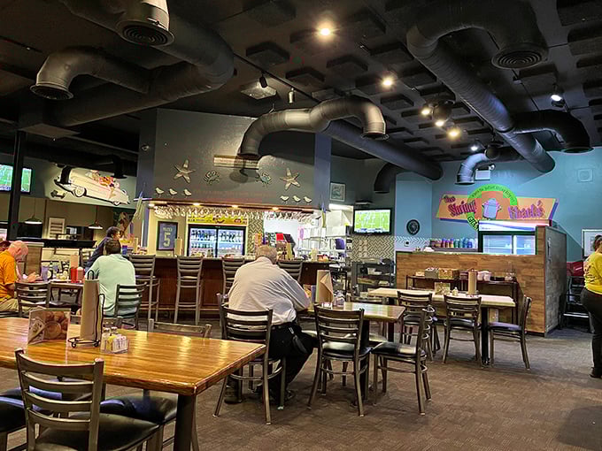 Step inside this nautical wonderland where exposed ductwork meets maritime charm and every table promises delicious discoveries.