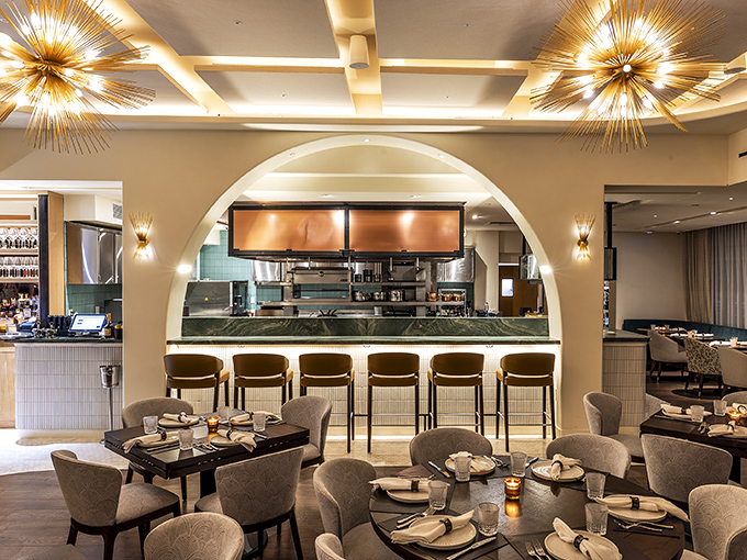 The golden glow of those starburst chandeliers transforms dinner into an event. This isn't just mood lighting—it's a mood elevation system.