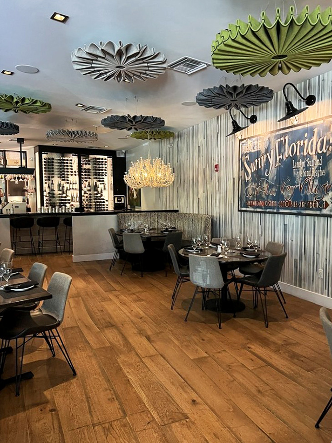 Step inside to discover a space where beach-chic meets fine dining. Those artistic ceiling fans? Pure Florida brilliance.