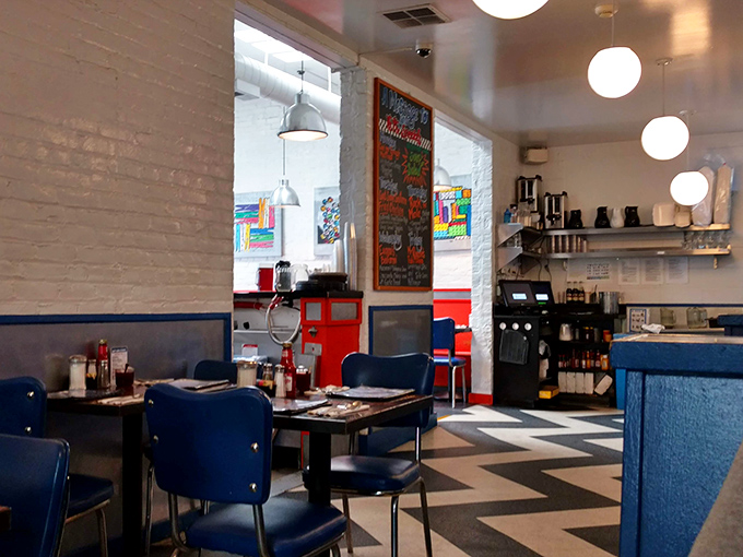 Mid-century modern meets punk rock aesthetic in this checkerboard wonderland. The blue booths have witnessed countless first dates, business deals, and hangover recoveries.