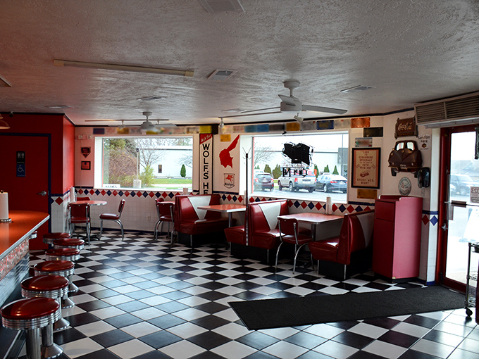 Step inside and suddenly it's 1955 again. The checkerboard floor and cherry-red booths aren't trying to be retro&mdash;they're authentic artifacts from when "viral" meant the flu.