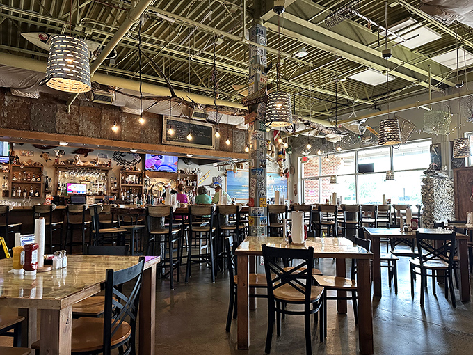 Industrial chic meets coastal charm in this surprisingly sophisticated space that transforms strip mall dining forever.