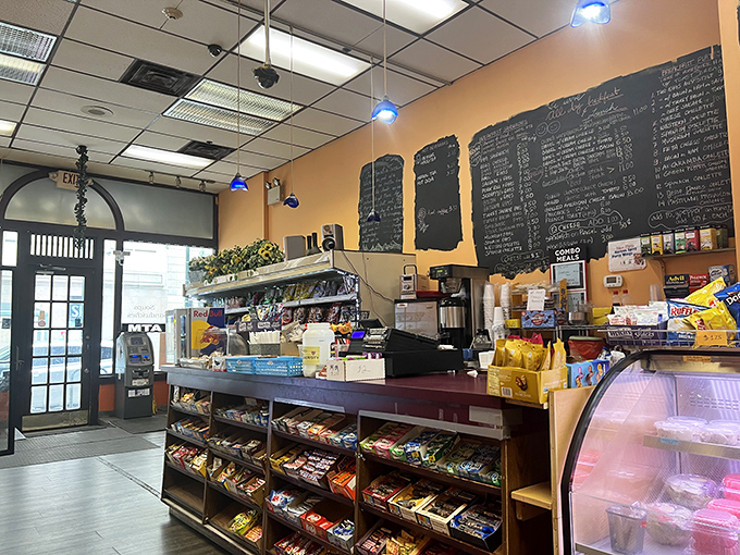 Inside, the warm orange walls and handwritten chalkboard menus promise authenticity in an age of digital sameness. This is breakfast without pretense.