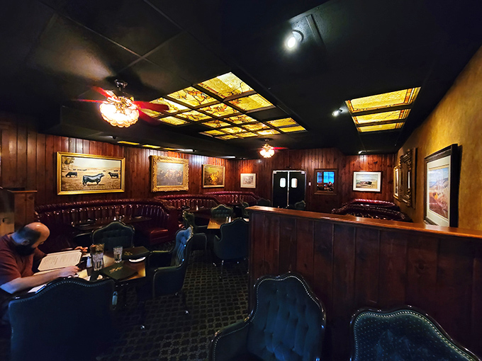 Step inside and time stands still. Wood paneling, amber ceiling lights, and red leather booths create the perfect backdrop for serious steak contemplation.