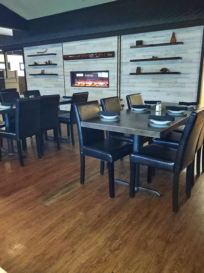 Modern meets rustic in this elegant dining space where a contemporary fireplace warms both the room and your soul before the main event arrives.