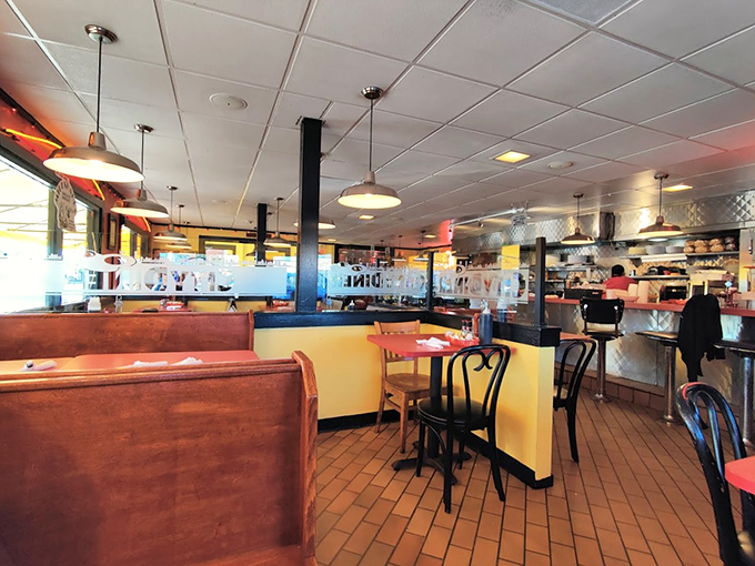 Classic wooden booths and counter seating create that perfect diner atmosphere where memories are made and pancakes disappear.