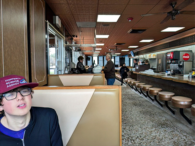 Inside, the counter ballet unfolds&mdash;swiveling stools await solo diners while servers navigate the narrow passage with the grace of seasoned performers. 