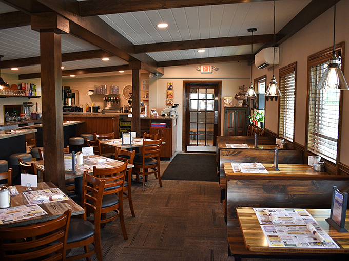 Wooden beams, warm lighting, and neatly set tables create that rare atmosphere where you instantly know you're in for honest-to-goodness cooking.