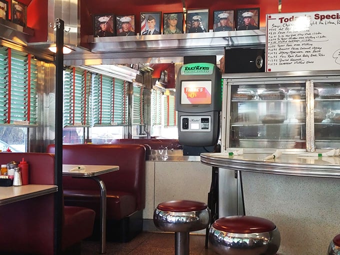 Step inside and the 1950s wrap around you like a warm hug, complete with cherry-red vinyl booths and chrome stools that practically beg for a spin.
