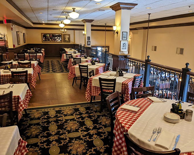 Classic red-checked tablecloths and warm wood tones create that "just got hugged by an Italian grandmother" feeling that makes every meal here special.