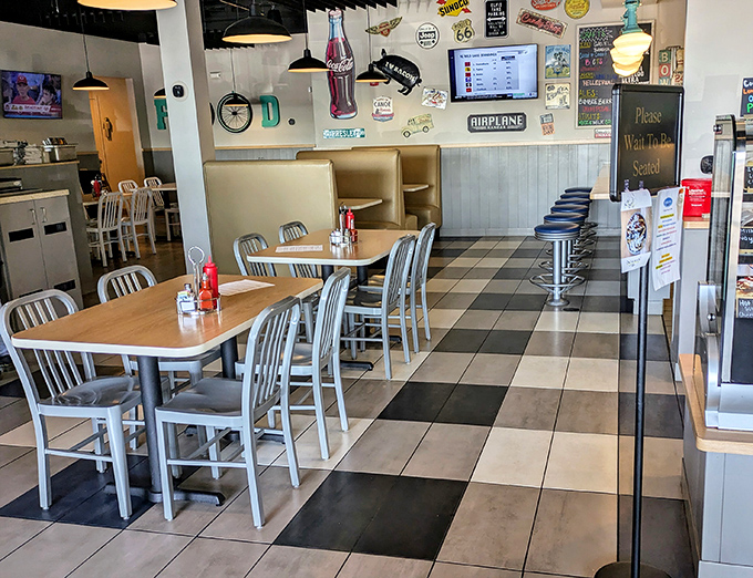 Classic diner aesthetics meet comfort food paradise. That black and white checkered floor practically whispers, "You're about to eat something gloriously unpretentious."