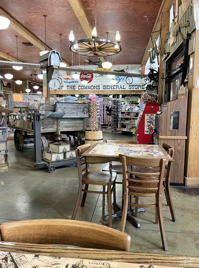 Wagon wheel chandelier, wooden tables, and treasures waiting to be discovered. This isn't d&eacute;cor&mdash;it's a living museum where the exhibits can actually go home with you.