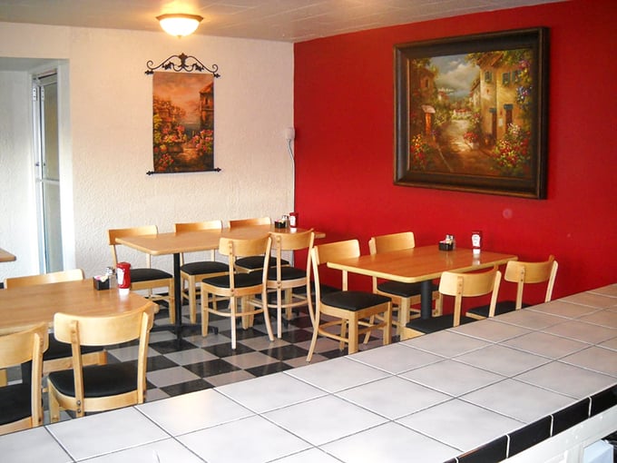 Red walls and checkered floors create that classic diner vibe where calories don't count and coffee refills are practically mandatory.