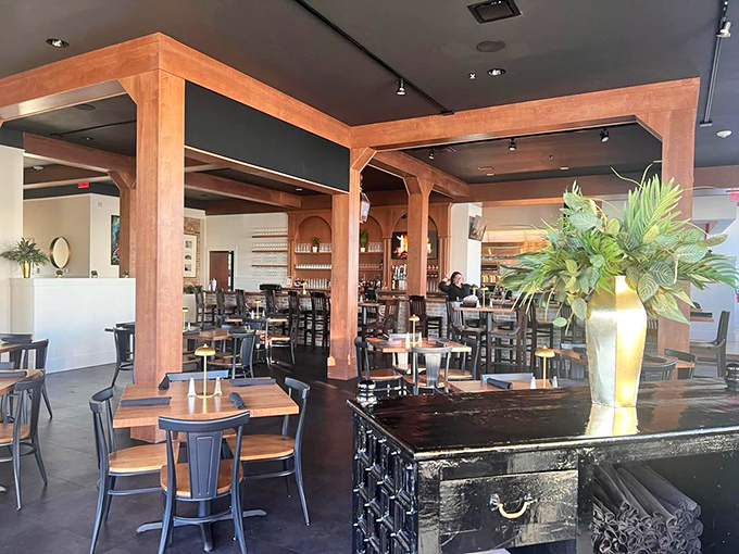 Warm wooden beams frame an interior that balances sophistication with Southern comfort &ndash; like wearing your best boots with a tailored suit.