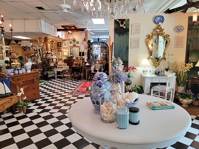 Black and white checkered floors create the perfect runway for antique shopping, where crystal chandeliers cast their approval on every find below.