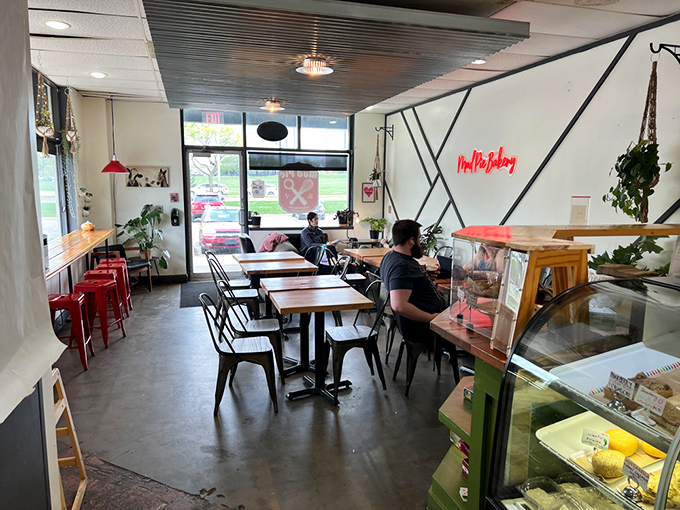 Industrial-chic meets cozy comfort in Mud Pie's interior, where that glowing neon sign practically whispers, "Yes, you should definitely take a photo for Instagram."