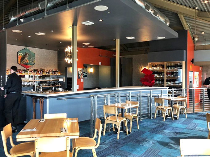 Modern nautical meets culinary workshop in this thoughtfully designed space. The blue tones and industrial touches echo the working harbor just outside.