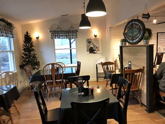 Inside, warm lighting and wooden tables create the perfect setting where comfort food meets genuine hospitality and conversation flows.