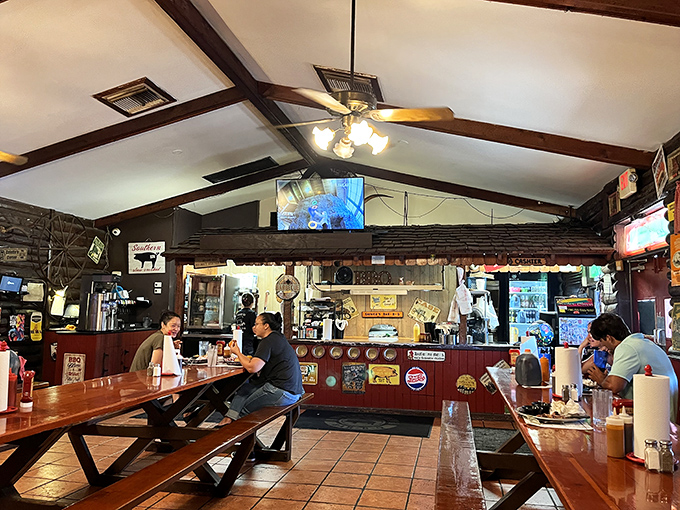 Inside, wooden picnic tables and rustic charm create the perfect backdrop for the serious business of barbecue appreciation.