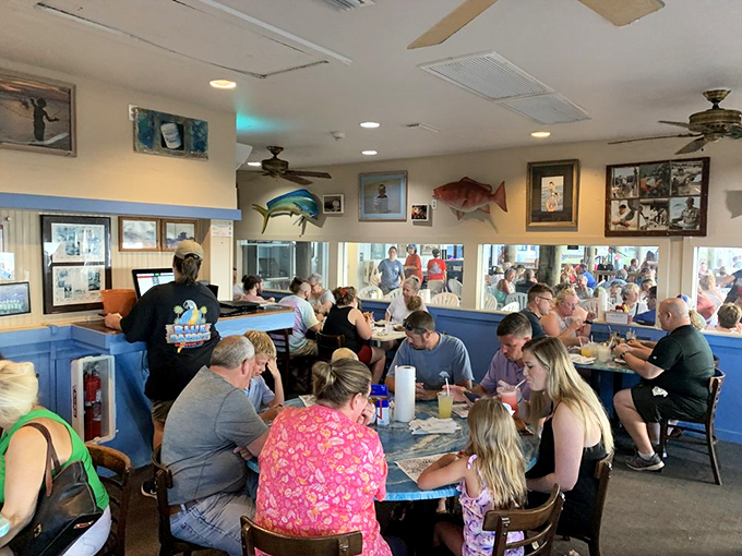 Inside, mounted fish keep watchful eyes on diners enjoying seafood feasts. It's like they're saying, "My cousin tastes delicious with lemon."