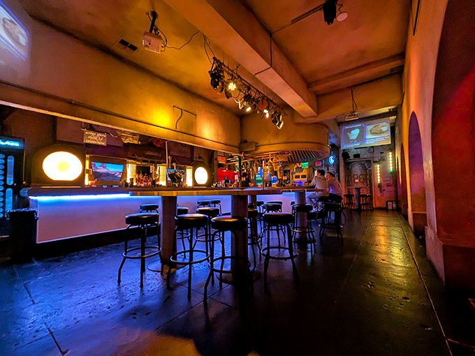 Bathed in amber and blue lighting, the bar area creates that perfect "I've just walked into another dimension" feeling that every great themed establishment strives for.