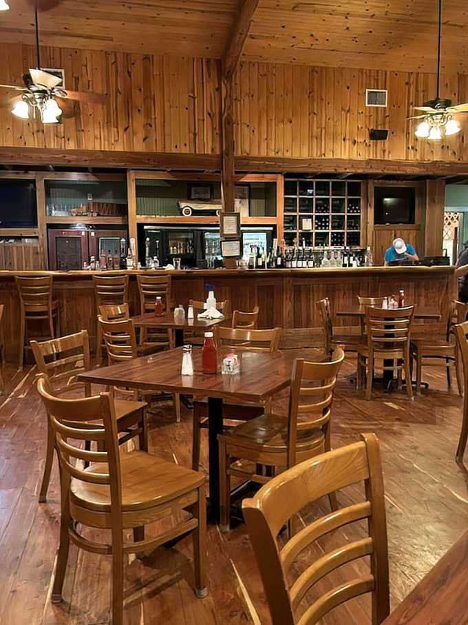 Warm pine paneling and sturdy wooden furniture create that "welcome home" feeling&mdash;if your home happened to serve restaurant-quality steaks and had a fully stocked bar.