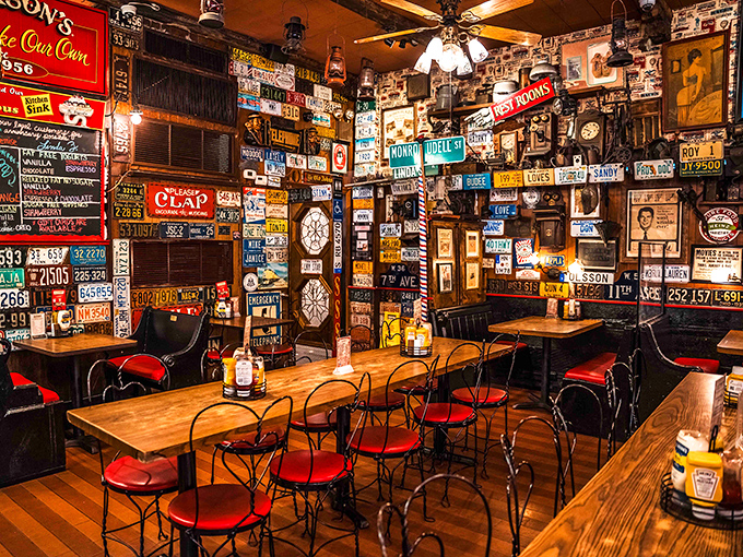 License plates, vintage signs, and memories cover every inch of wall space. It's like America's attic decided to serve incredible food.