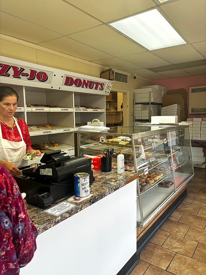 Behind the counter, where donut magic happens daily. No fancy equipment needed&mdash;just decades of know-how and dedication to craft.