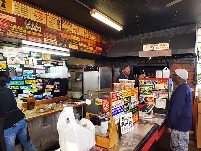 Where barbecue dreams come true &ndash; the ordering counter's wall of signs tells stories of countless satisfied customers and decades of smoky wisdom.