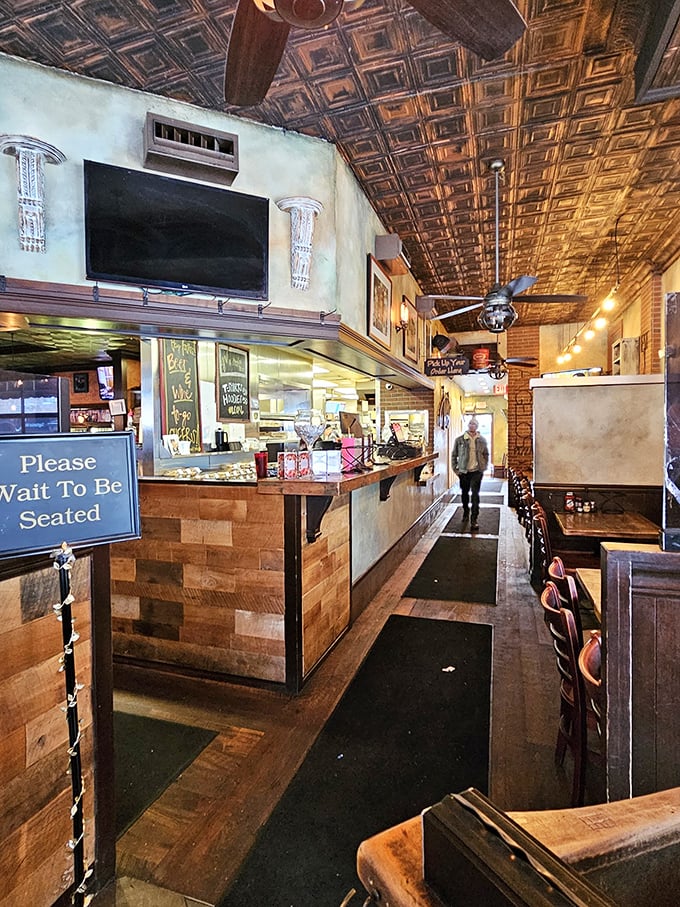 That ornate tin ceiling isn't just decoration&mdash;it's witnessed decades of "this is the best pizza I've ever had" declarations from first-time visitors.