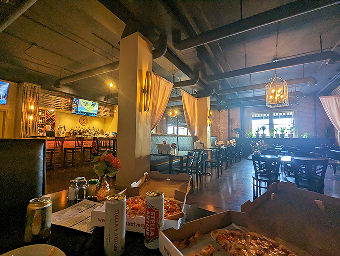 Industrial chic meets Italian comfort. Exposed brick, soft lighting, and the promise of pizza perfection create an atmosphere where memories are made one bite at a time.