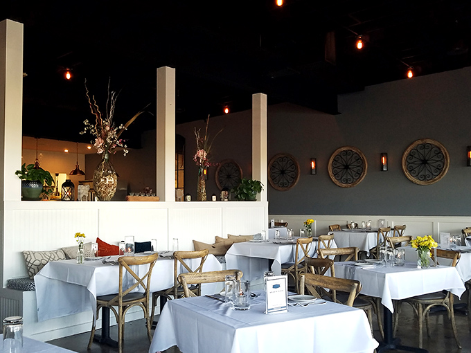 The dining room strikes that perfect balance&mdash;elegant enough for special occasions yet comfortable enough to linger, with those distinctive circular accents adding nautical flair.